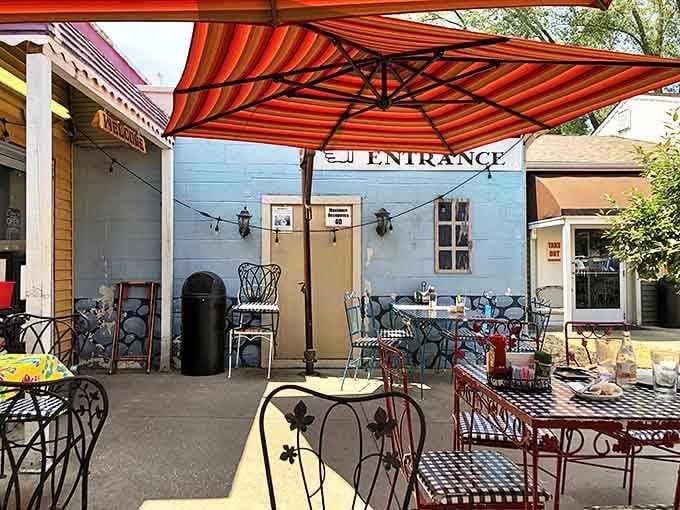 The outdoor patio offers a cheerful retreat with colorful umbrellas and charming furniture &ndash; al fresco dining at its most inviting.