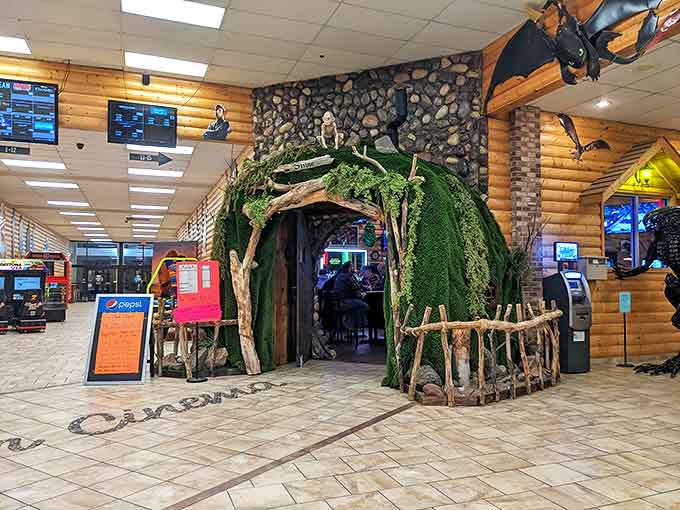 The magical moss-covered entrance to The Shire beckons adventurous diners through what appears to be a portal to another world.