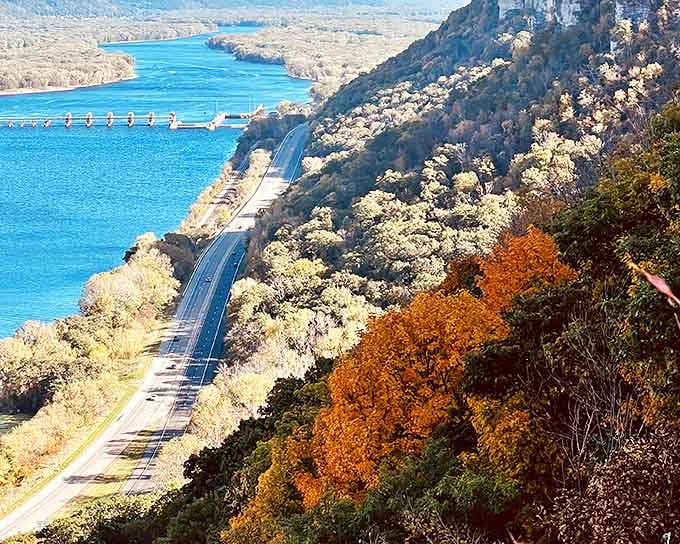 A breathtaking panorama where the Mississippi River curves majestically between Minnesota's dramatic bluffs, nature's own masterpiece on display.