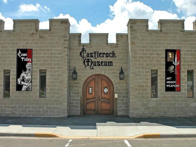The stone facade of Castlerock Museum stands like a medieval fortress in downtown Alma, complete with battlements and wooden doors fit for knights.