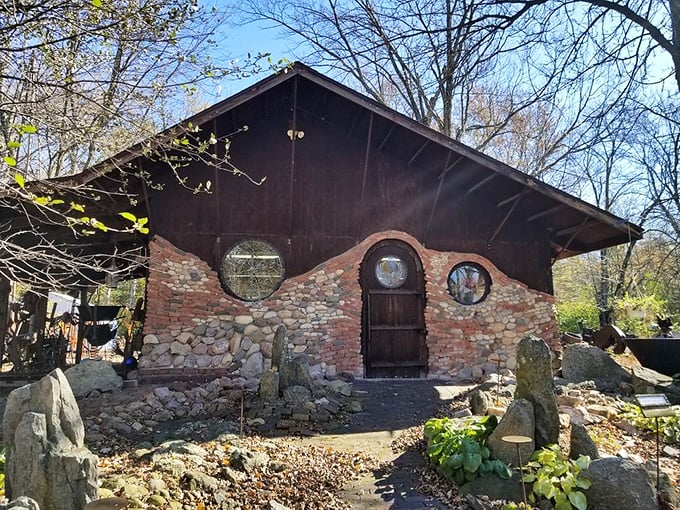 The stone and wood facade of Jurustic Park welcomes visitors with its quirky round windows and rustic charm. A fantasy world awaits beyond that wooden door!