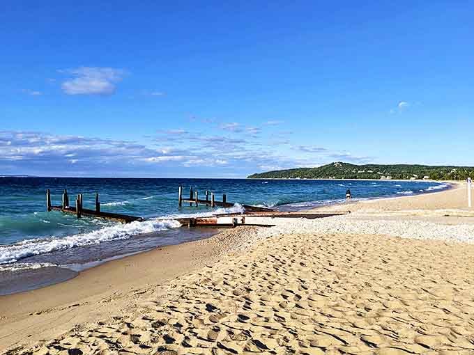 Golden sands meet crystal waters at Lake Street Beach, where Michigan masquerades as the Caribbean on sunny summer days.