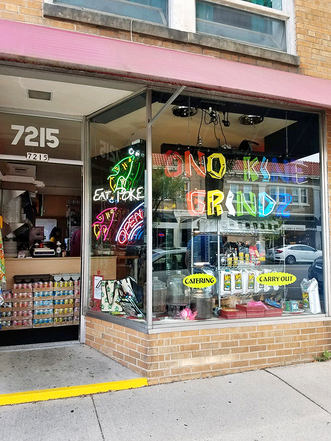 Neon dreams! Ono Kine Grindz's colorful window sign promises authentic Hawaiian flavors in the heart of Wisconsin.