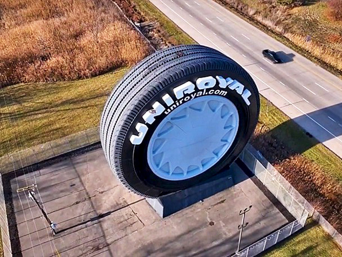 The massive Uniroyal Tire looms over I-94 like a rubber colossus. Once a Ferris wheel at the 1964 World's Fair, now it's Michigan's most eye-catching roadside giant.