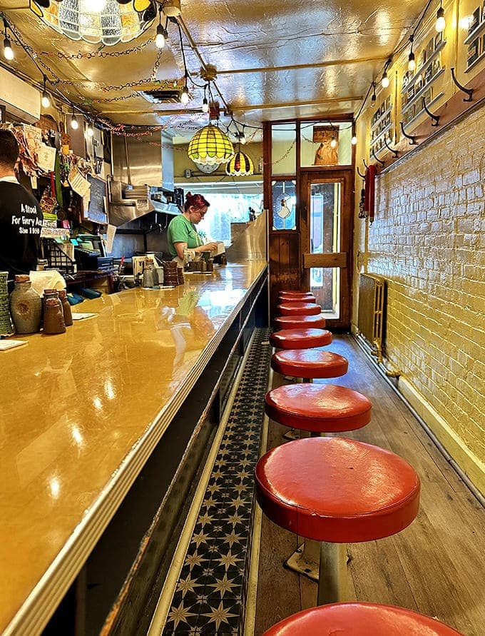 The narrow interior showcases Al's famous counter with its row of red stools – breakfast theater in the round where strangers become friends over coffee.