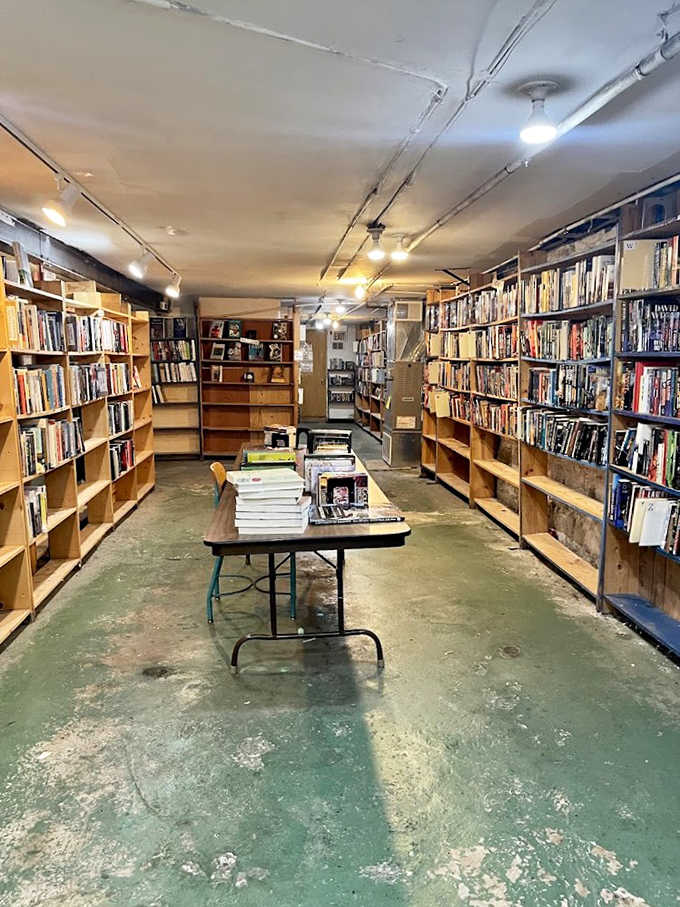 The basement level reveals a bibliophile's dream &ndash; floor-to-ceiling shelves creating a maze of literary treasures waiting to be discovered.