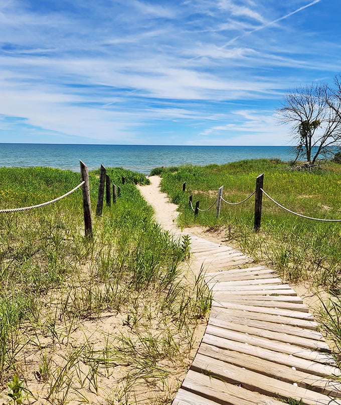 Where sand meets sky meets water &ndash; this boardwalk leads to Lake Michigan's impossibly blue embrace.