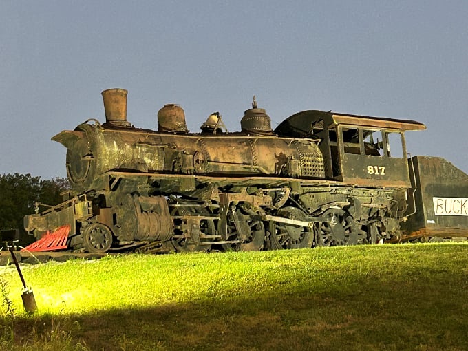 The Buckeye Express steam locomotive rests in silent dignity, a rusted titan from America's golden age of rail travel.