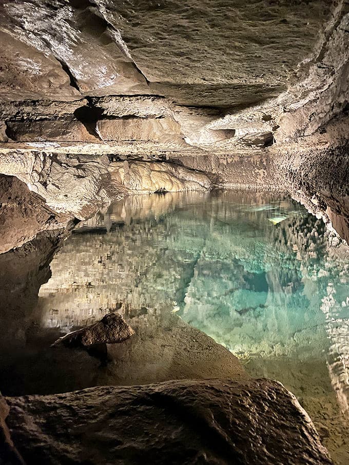 The underground pool in Mystery Cave reflects formations with mirror-like clarity, creating an otherworldly landscape that's been developing for millennia.