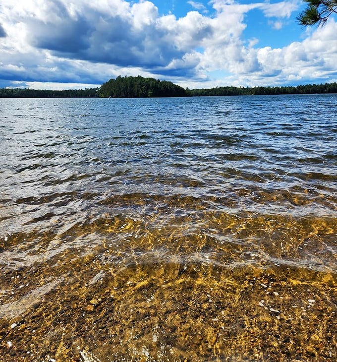 Crystal clear waters meet golden shores at Star Lake, where nature's perfection feels almost deliberately designed for visitors.
