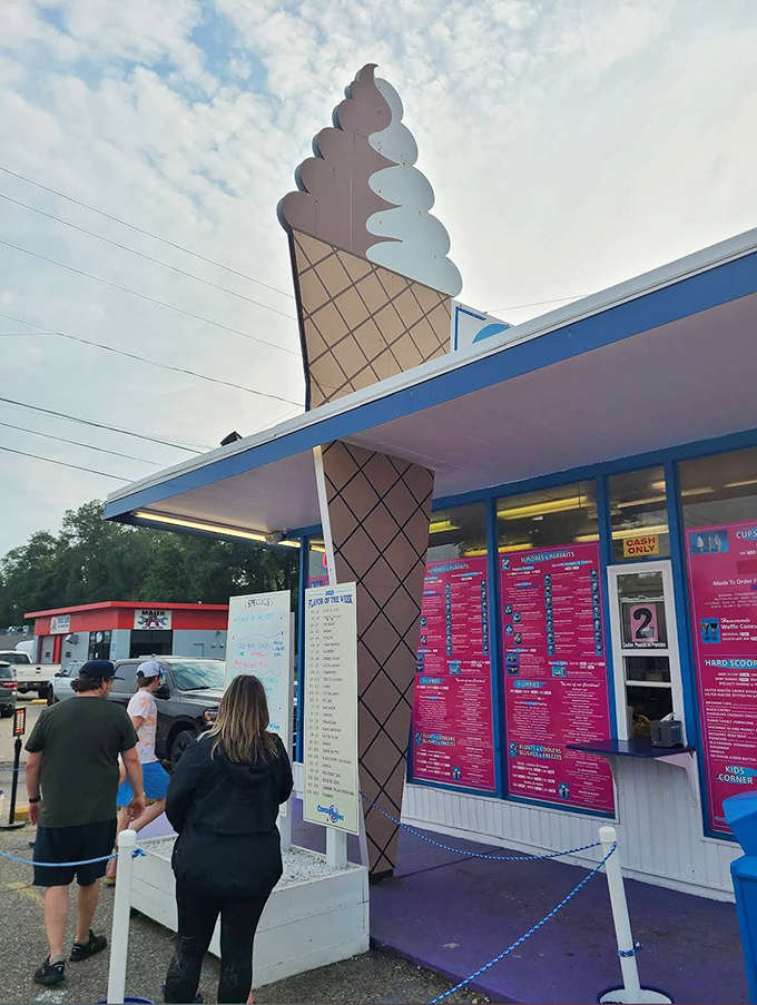 Customers contemplating life's most important decision: which heavenly flavor to choose from the extensive menu board.