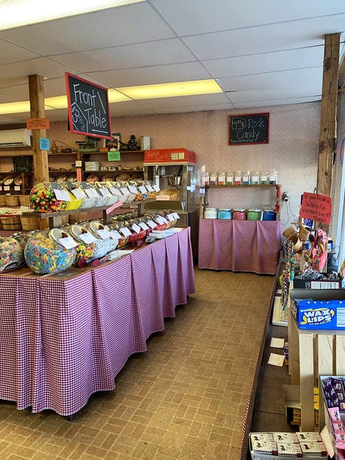 Inside, wooden barrels overflow with colorful treats, proving that candy displays are basically edible art installations.