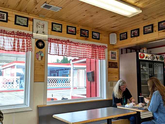 Inside, red gingham curtains and classic car photos create that perfect small-town diner vibe where calories definitely don't count.