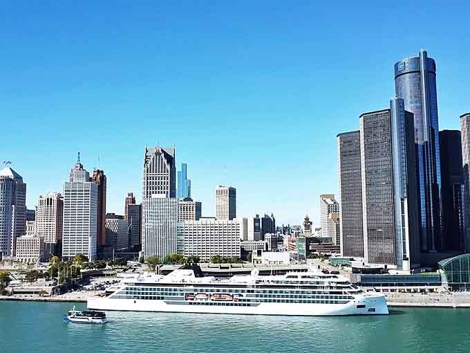 The Detroit skyline dazzles from across the water, a testament to Midwest architectural ambition with Canada waving hello from the other shore.