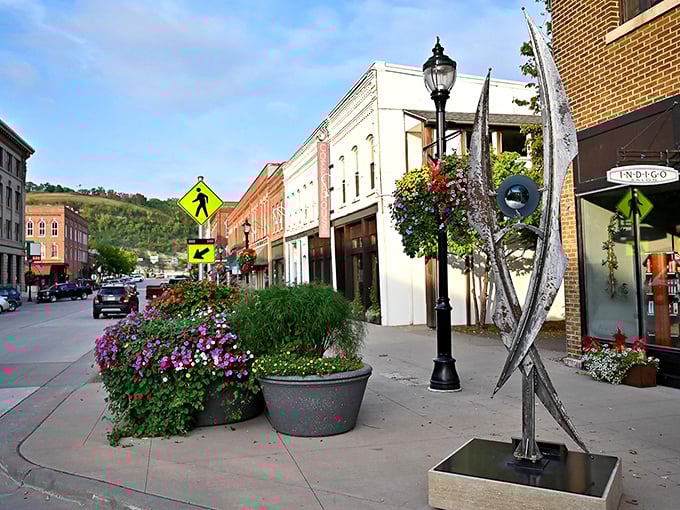 Downtown Red Wing's charming streets lined with historic architecture, colorful flower planters, and locally-owned shops that invite leisurely exploration.