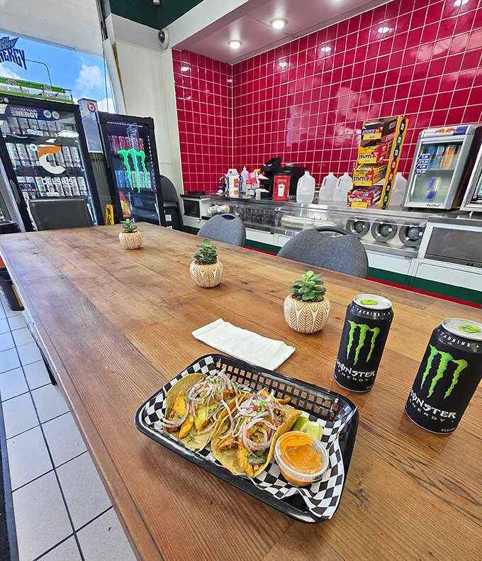 Red tiles and wooden tables transform this gas station corner into a cozy taqueria where Monster Energy meets monstrous flavor.