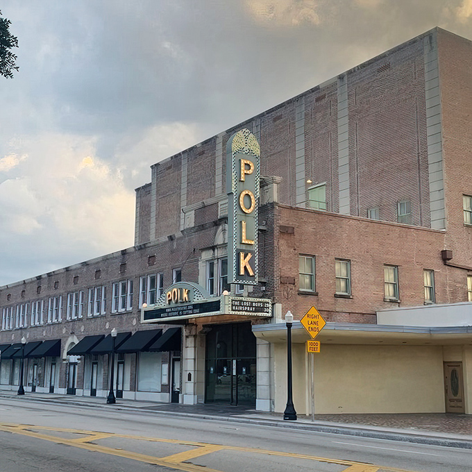 Dusk settles over downtown Lakeland as the Polk Theatre's vertical sign illuminates, promising an evening of entertainment that transcends the ordinary multiplex experience.