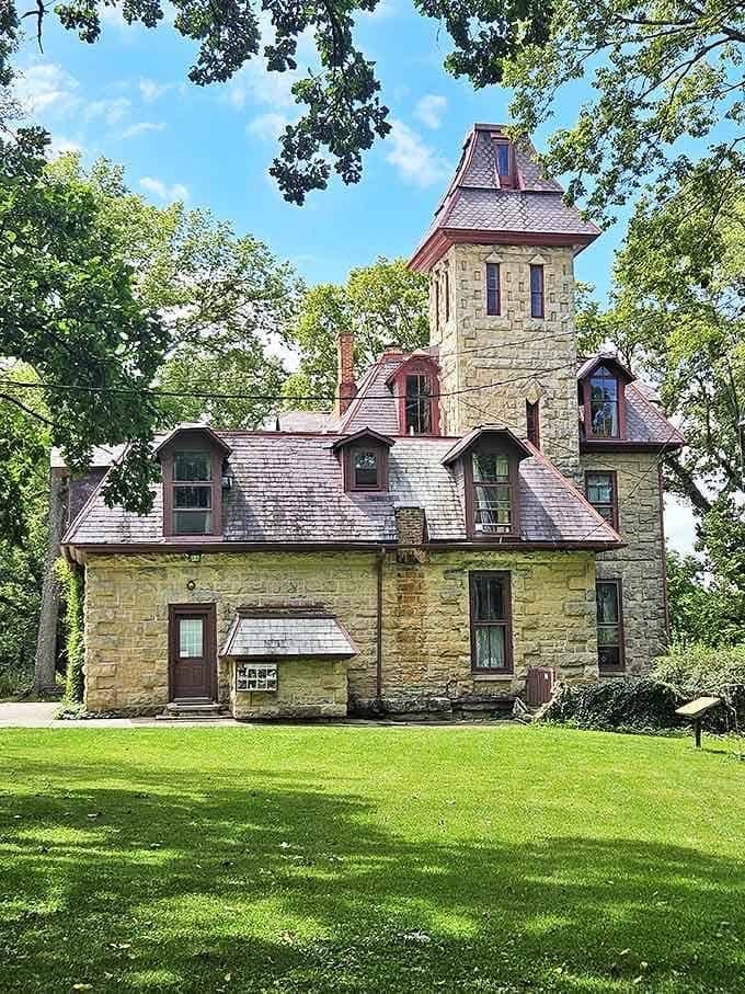 The castle's Gothic Revival architecture features a striking tower, dormer windows, and meticulous stonework that has weathered over 150 years of Midwestern seasons.