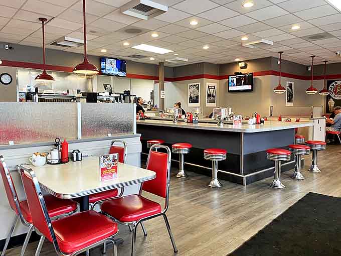 Classic diner charm meets modern comfort in this red-and-chrome haven where calories don't count and diet plans go to die happy.