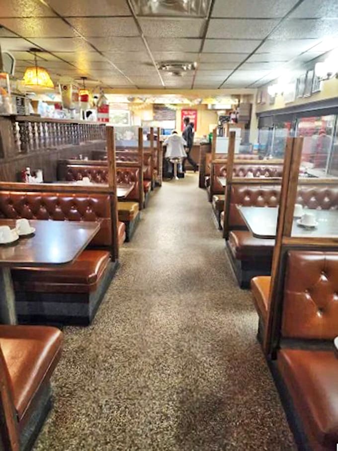 Those brown vinyl booths have cradled more first dates, business deals, and family celebrations than a wedding chapel, each one worn perfectly comfortable by decades of diners.