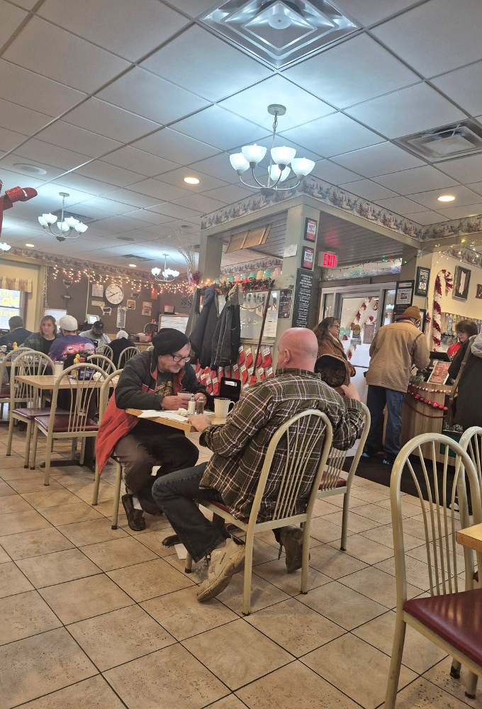 Inside George's, time slows down as regulars settle into familiar chairs, where conversations flow as freely as the coffee.