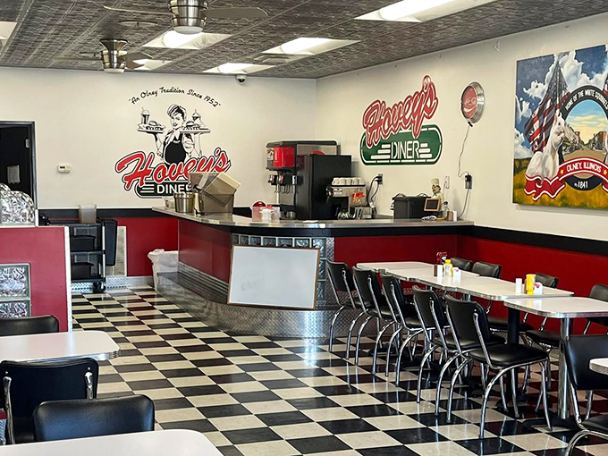 Classic black and white checkered floors meet cherry-red accents in this time capsule of American diner culture.