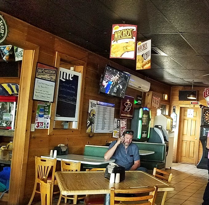The cozy wood-paneled interior creates that perfect Wisconsin tavern atmosphere &ndash; where burger decisions and cold beers flow freely.