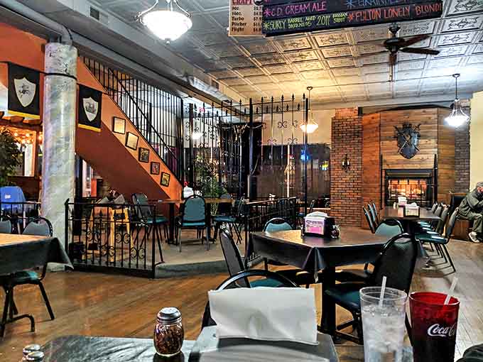 Warm brick walls and wrought iron details create cozy dining nooks throughout the interior, where medieval charm meets Minnesota hospitality.