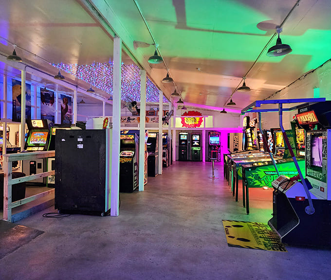 Sunlight streams through garage-style windows, illuminating a space where industrial-chic meets Southern comfort in perfect harmony.
