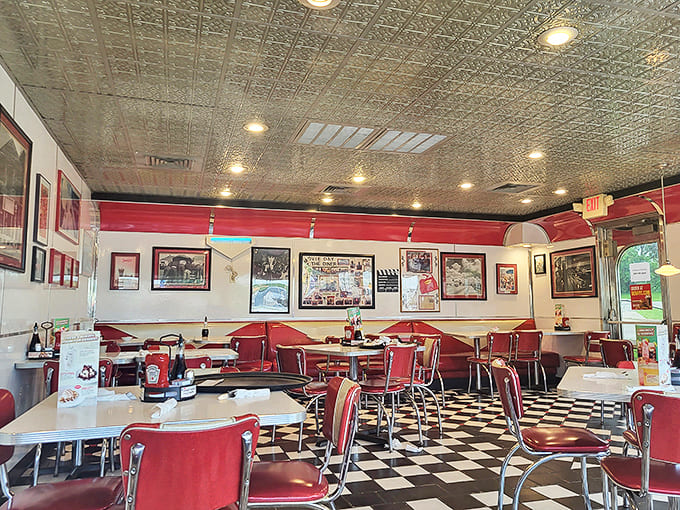Step inside and time rewinds – red vinyl booths and checkerboard floors create the perfect stage for culinary memories waiting to happen.