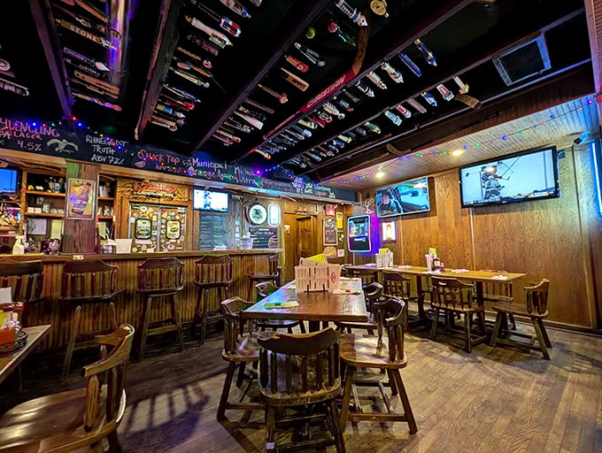 Hockey sticks and tap handles create a ceiling museum while wooden tables tell silent stories of countless Oxford gatherings.