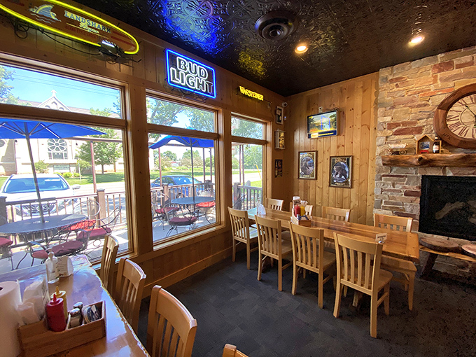 Warm wood paneling and cozy seating create the perfect backdrop for serious burger contemplation at King's Place.