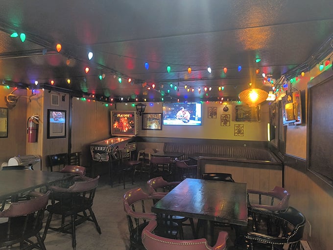 Colorful string lights cast a warm glow across the tavern's interior, creating an atmosphere that's both festive and intimately cozy.