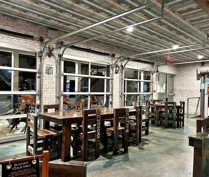 Industrial-chic meets maritime charm in this dining area, where weathered wood ceilings and whitewashed brick create the perfect backdrop for seafood feasting.