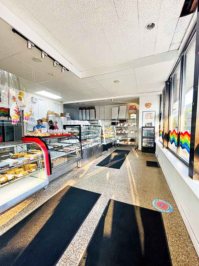 Inside this temple of temptation, display cases showcase an edible art gallery where diet plans come to die happily.