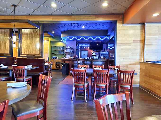 Warm wood tones and cozy seating create the perfect backdrop for island escapism, where Michigan winters melt away with each bite.