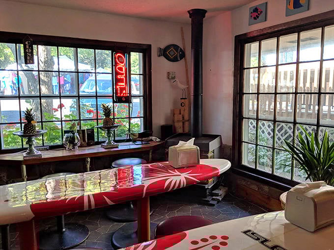 Cozy interior vibes with vintage surfboard tables and large windows create the perfect atmosphere for chocolate contemplation.