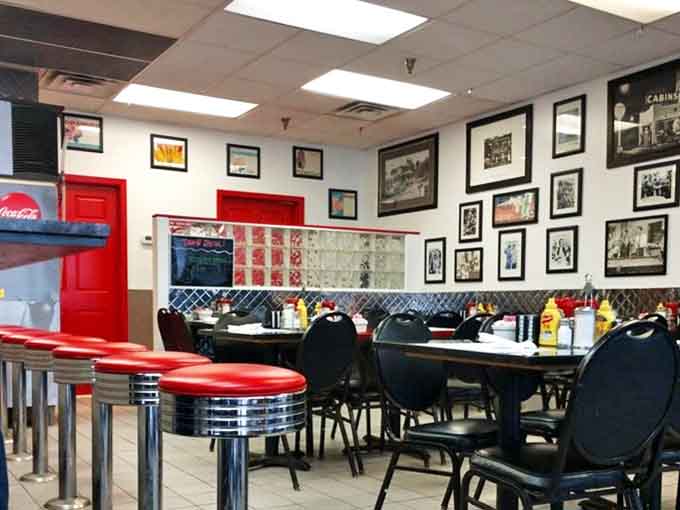Classic diner aesthetics transport you to simpler times &ndash; red vinyl, chrome accents, and walls filled with community memories.