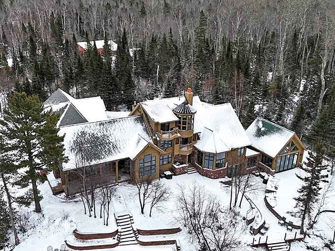 Winter transforms Keweenaw Castle into a snow-dusted fairytale retreat, nestled among frost-tipped pines like something from a storybook adventure.