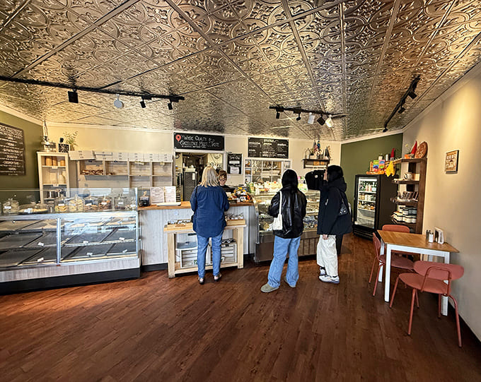 Step inside to find a cozy interior where that stunning pressed tin ceiling catches light like culinary jewelry.