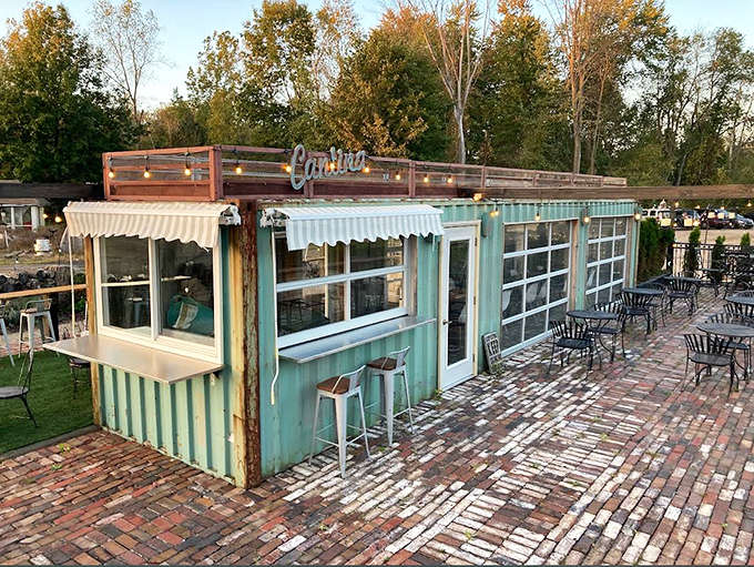 Outdoor bar seating where the drinks are cold and the barbecue smoke perfumes the air like expensive cologne.