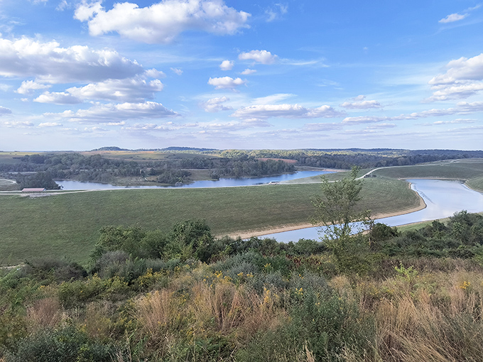 The rolling landscape of The Wilds stretches to the horizon, showcasing Ohio's unexpected beauty with winding waterways cutting through verdant hills.