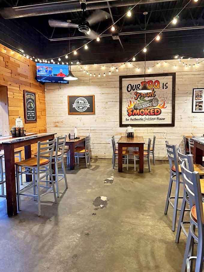 String lights dance across the ceiling while wooden walls create the perfect backdrop for barbecue bliss.