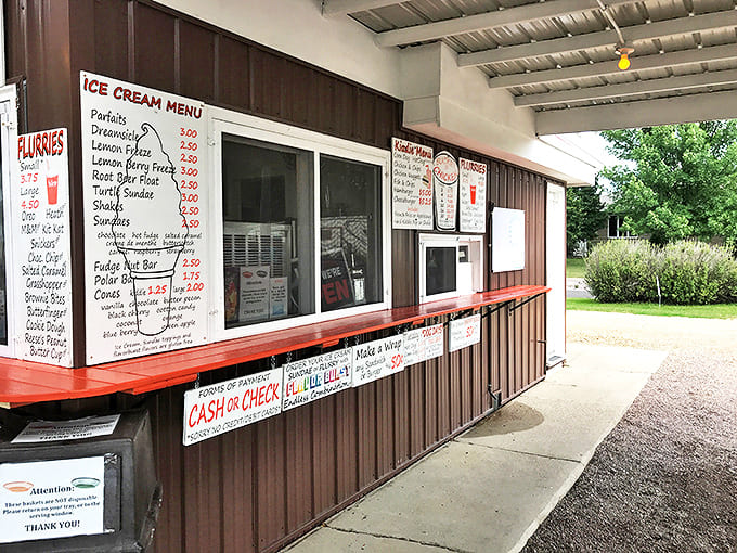 Order windows where dreams come true &ndash; handwritten menus showcase decades of drive-in perfection without a digital screen in sight.