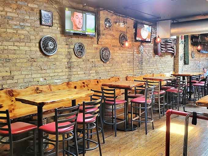 Rustic charm meets comfort in this cozy interior where exposed brick walls and wooden tables create the perfect backdrop for pretzel perfection.
