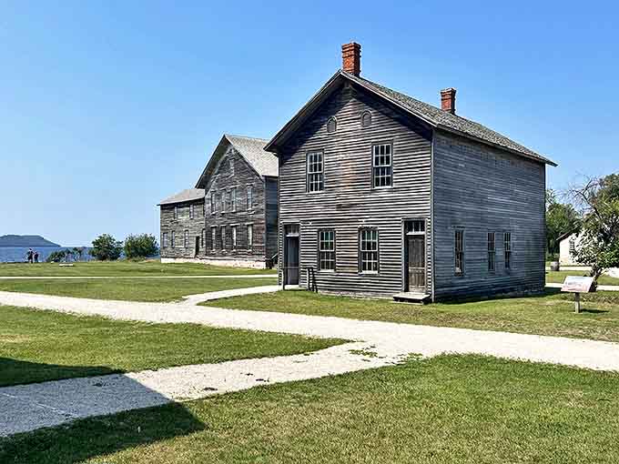Weather-worn wooden residences line quiet streets, their weathered clapboards whispering tales of families who once called Fayette home.