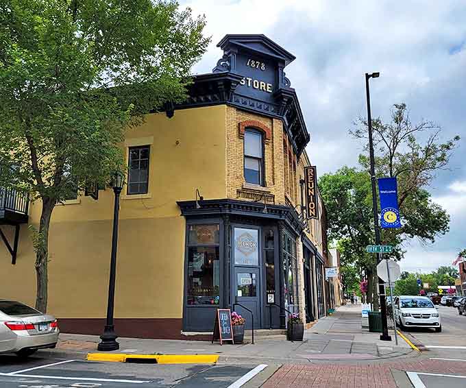 The 1878 Store building stands proudly on the corner, its yellow brick and black trim a testament to Northfield's preserved architectural heritage.