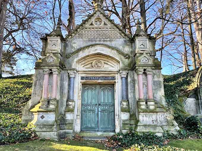 The Schofield Mausoleum stands like a miniature cathedral, its teal door a mysterious portal between worlds.
