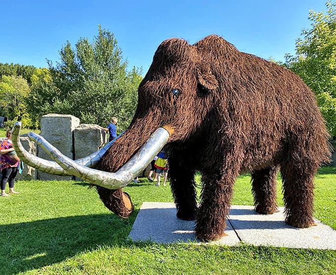 The Woolly Mammoth stands frozen in time, its impressive tusks and shaggy coat meticulously crafted from thousands of individual pieces.