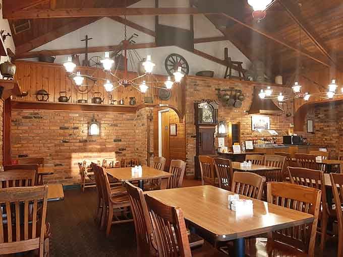 Exposed beams, warm wood, and antique touches create an atmosphere that feels like dining in the world's coziest, most delicious time machine.